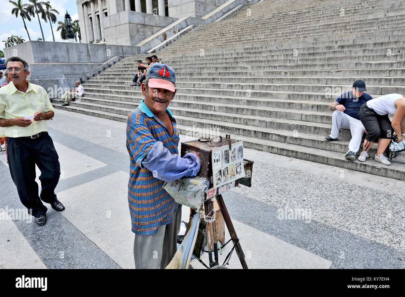 HAVANA, CUBA, MAY 11, 2009. A man with an old box camera in front of El ...