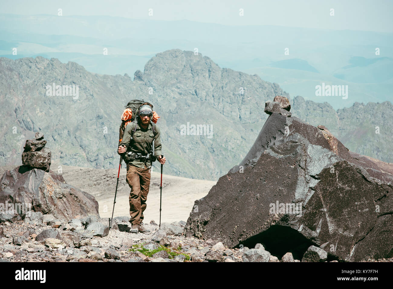 Traveler Man hiking in mountains Travel Lifestyle concept adventure ...
