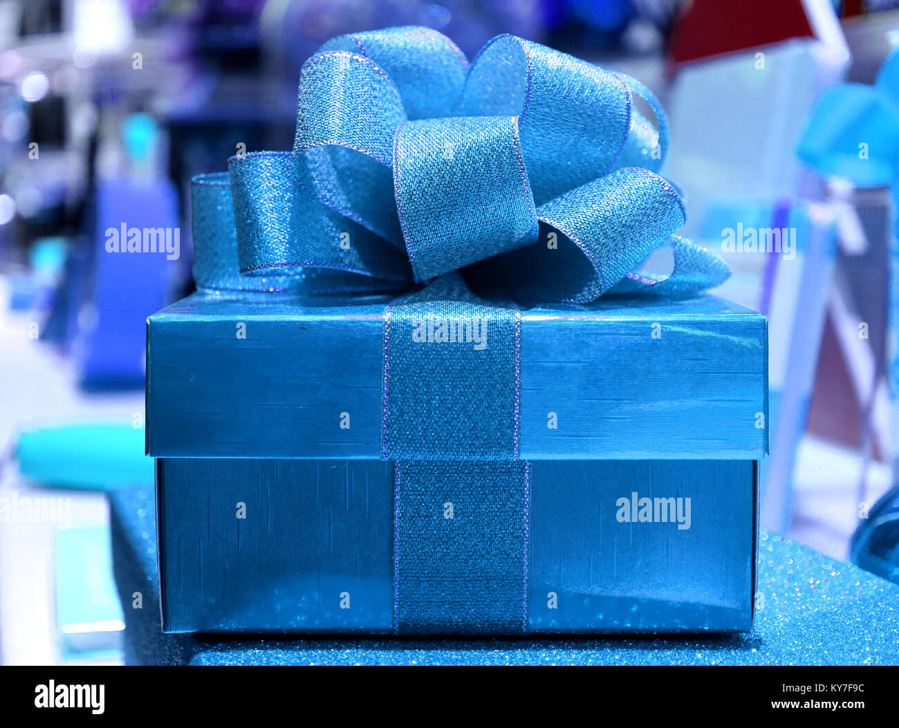 Front View of Shiny Blue Square Gift Box with Glitter Blue Ribbon Bow ...