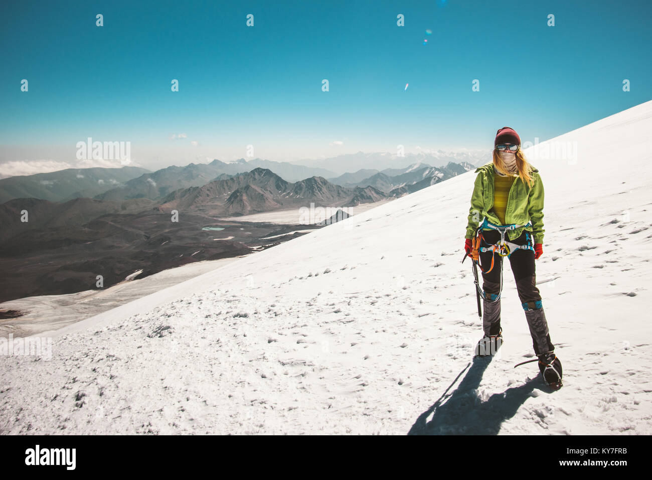 Woman alpinist climbing in mountains glacier Travel Lifestyle success ...