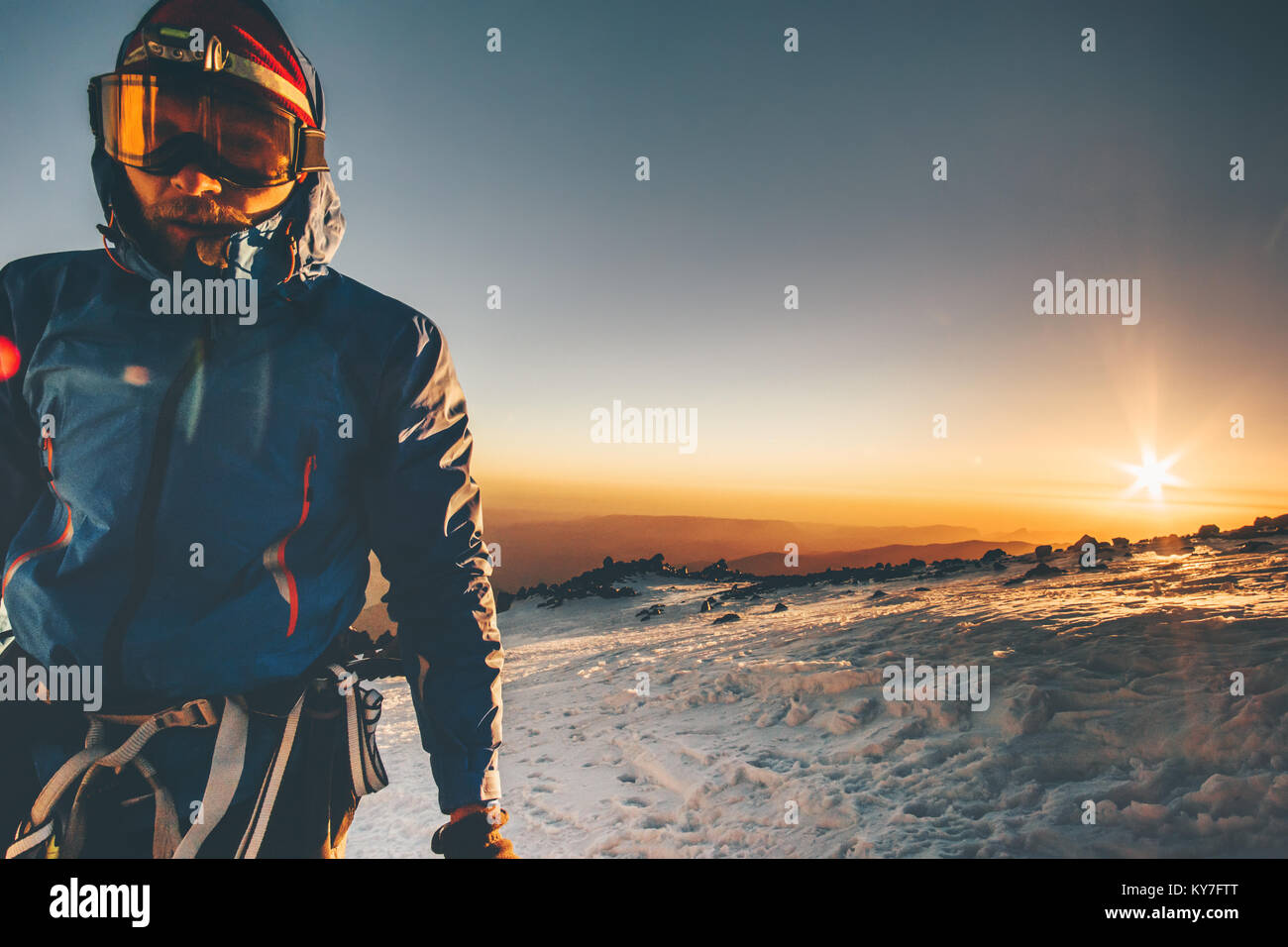 Man alpinist climbing in mountains Travel Lifestyle concept adventure ...