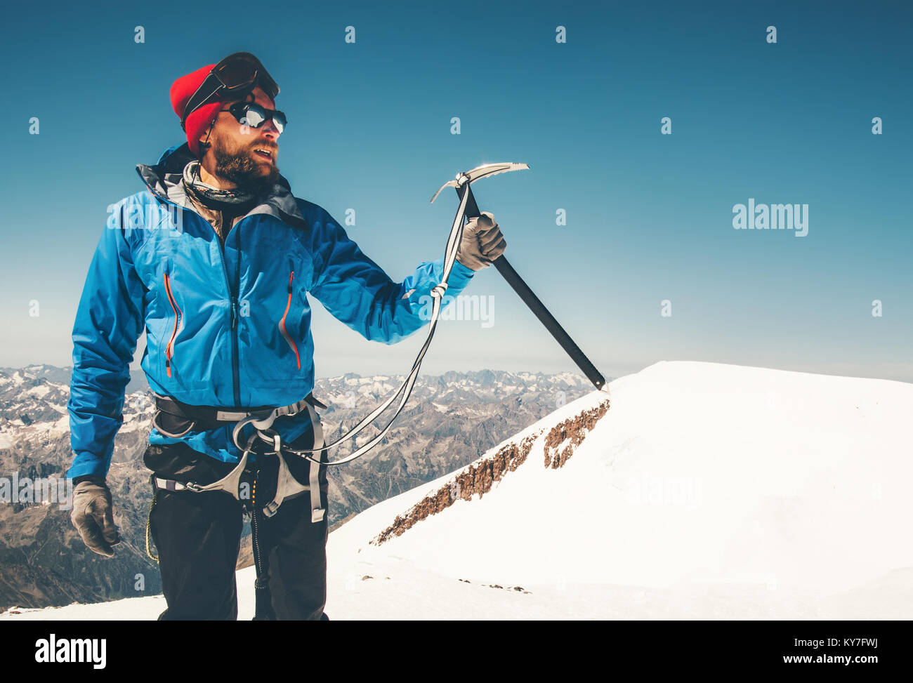 Man climber holding ice axe on mountain glacier Travel Lifestyle ...