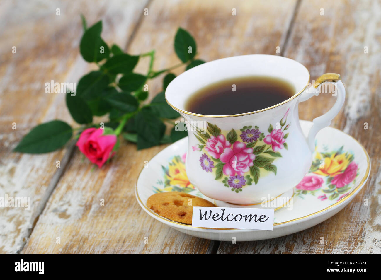 Welcome card with cup of tea in vintage porcelain up, cookie and pink ...