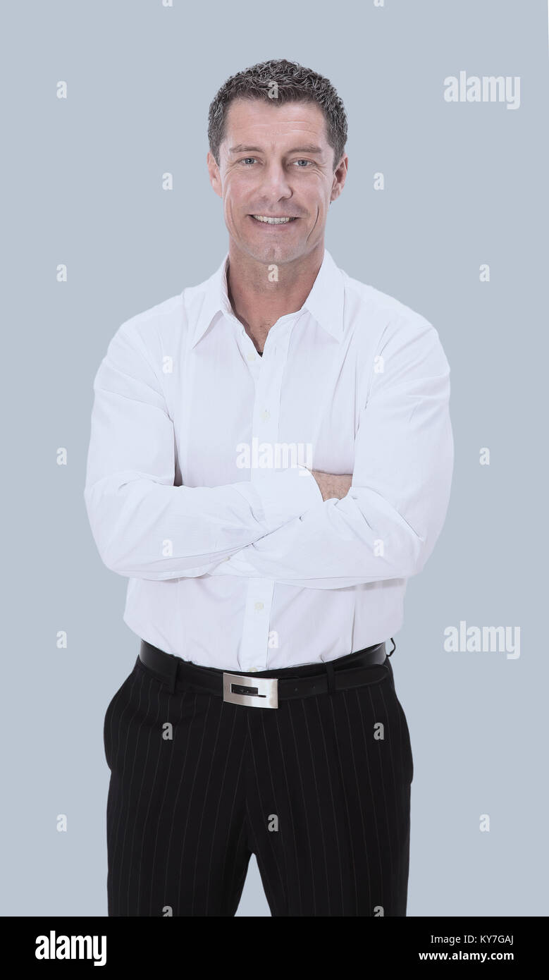 Happy mature man in shirt smiling while standing against gray Stock ...