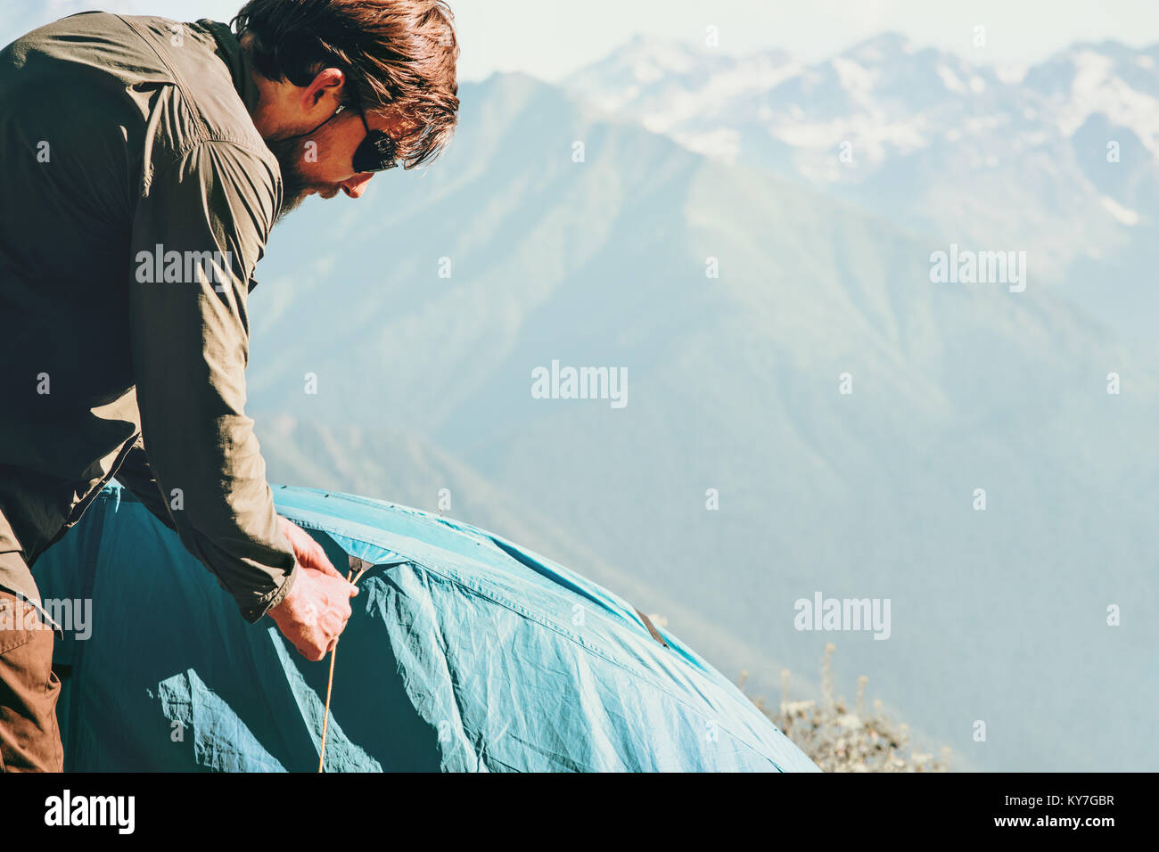 Man Traveler with tent camping equipment at mountains outdoor Travel ...