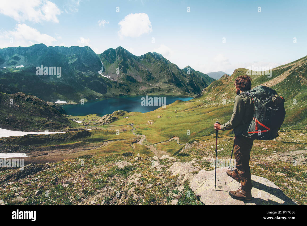 Traveler Man enjoying lake and mountains view Travel Lifestyle concept ...