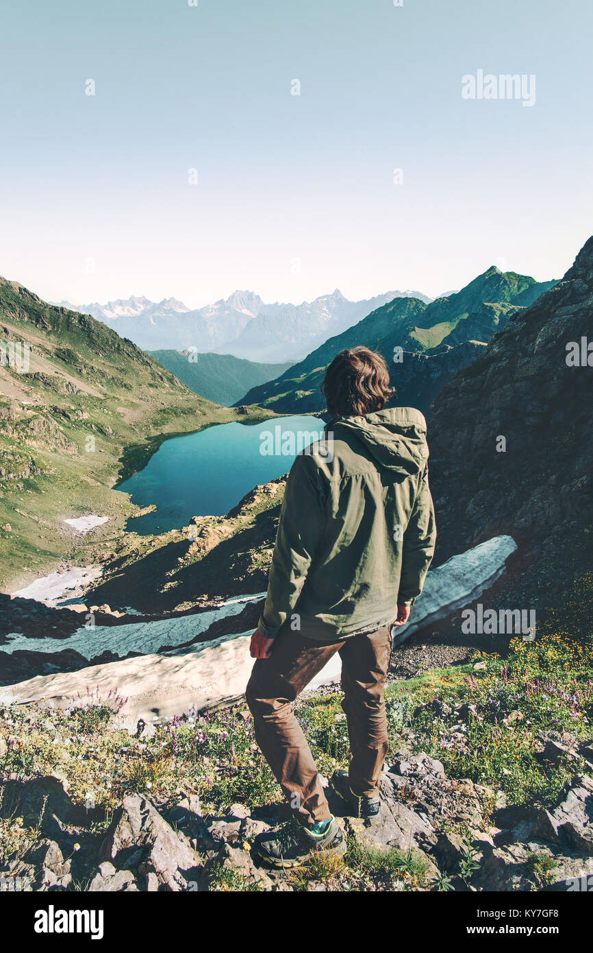 Man explorer wander lake in mountains aerial view Travel Lifestyle ...