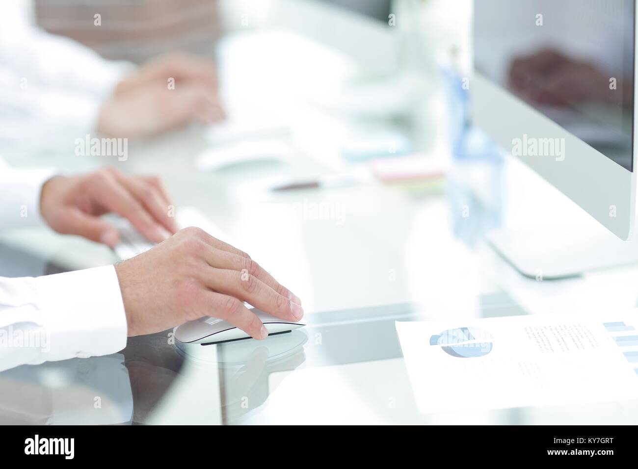 hands typing text on the computer keyboard. blurred business background ...