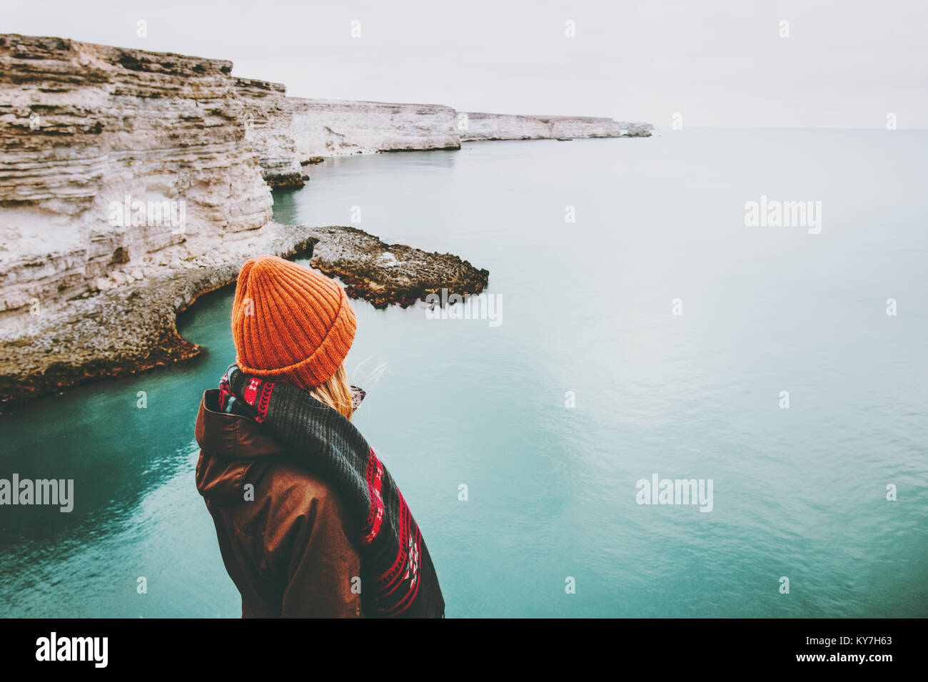 Woman walking at cold sea view alone Travel Lifestyle concept adventure ...