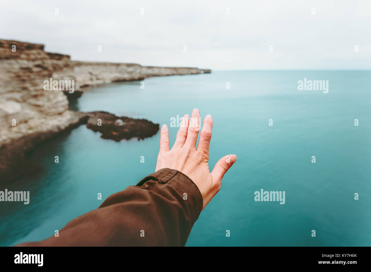 Hand touching cold sea landscape emotional Travel Lifestyle wanderlust ...