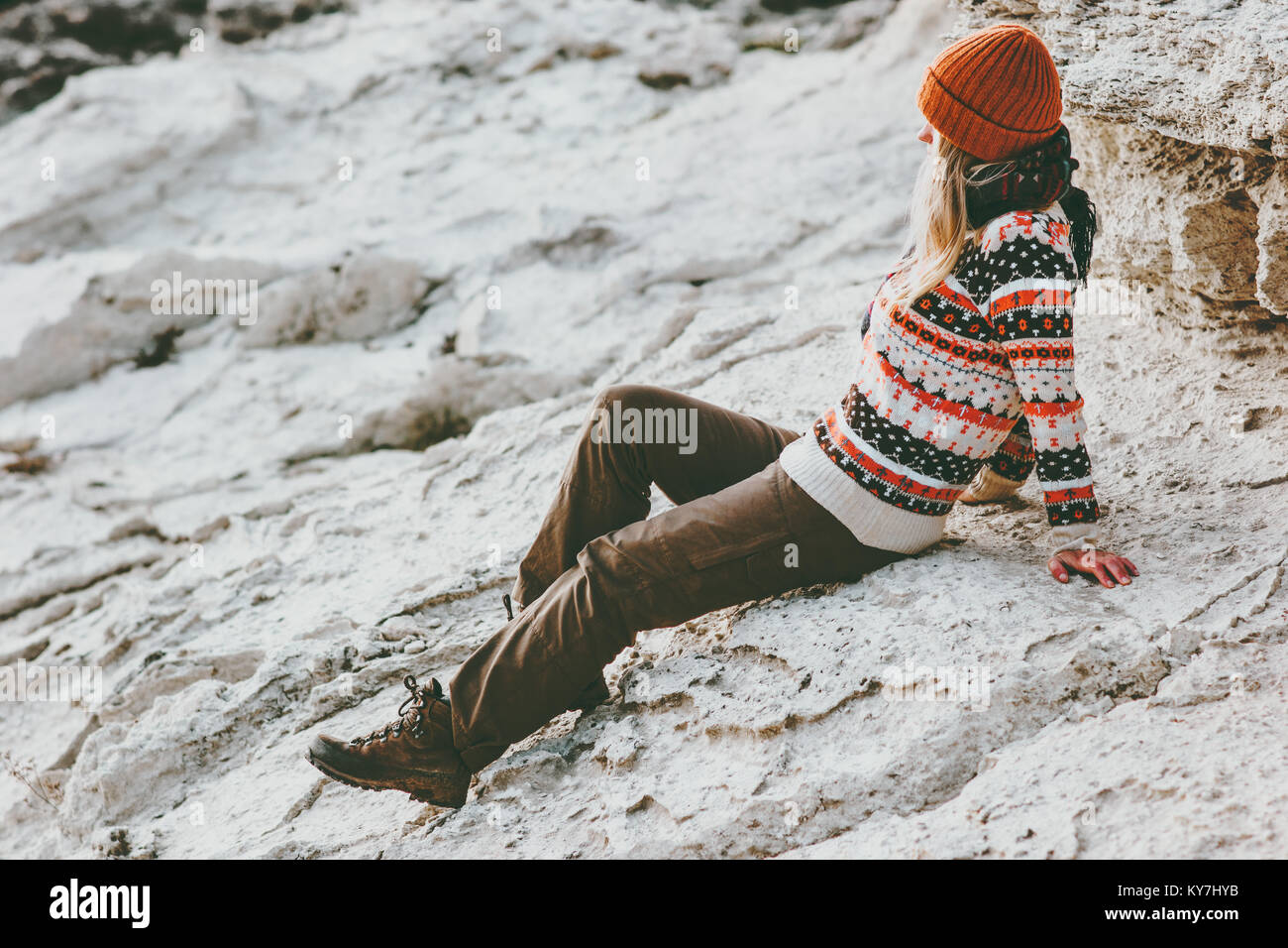 Woman relaxing alone at rocky seaside Travel Lifestyle fashion concept ...
