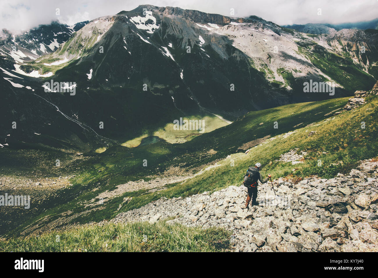 Man hiker trekking in mountains Travel Lifestyle adventure wanderlust ...