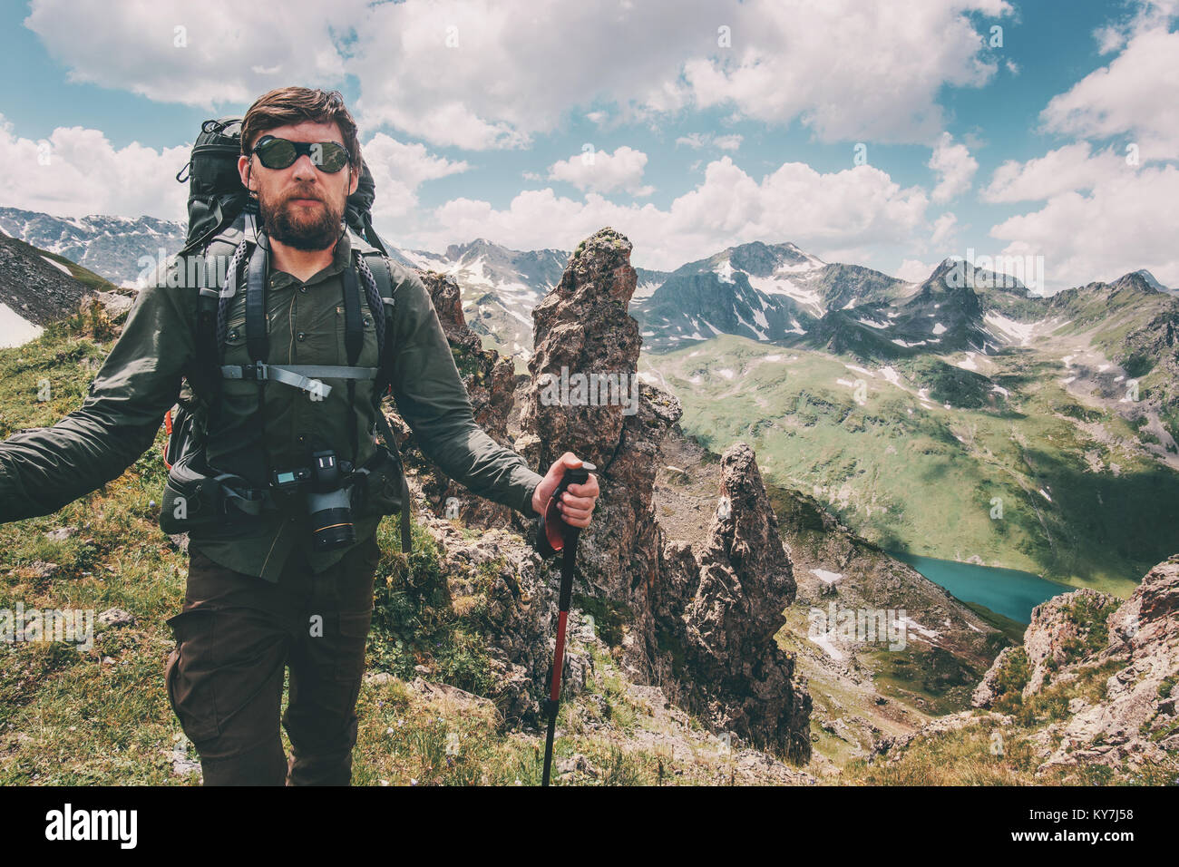 Man traveler hiking with backpack in mountains landscape Travel ...