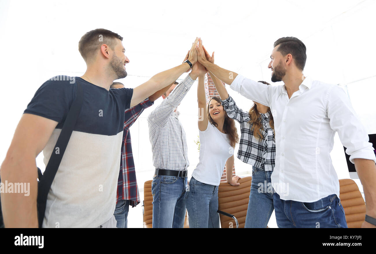 creative team giving each other a high five Stock Photo - Alamy