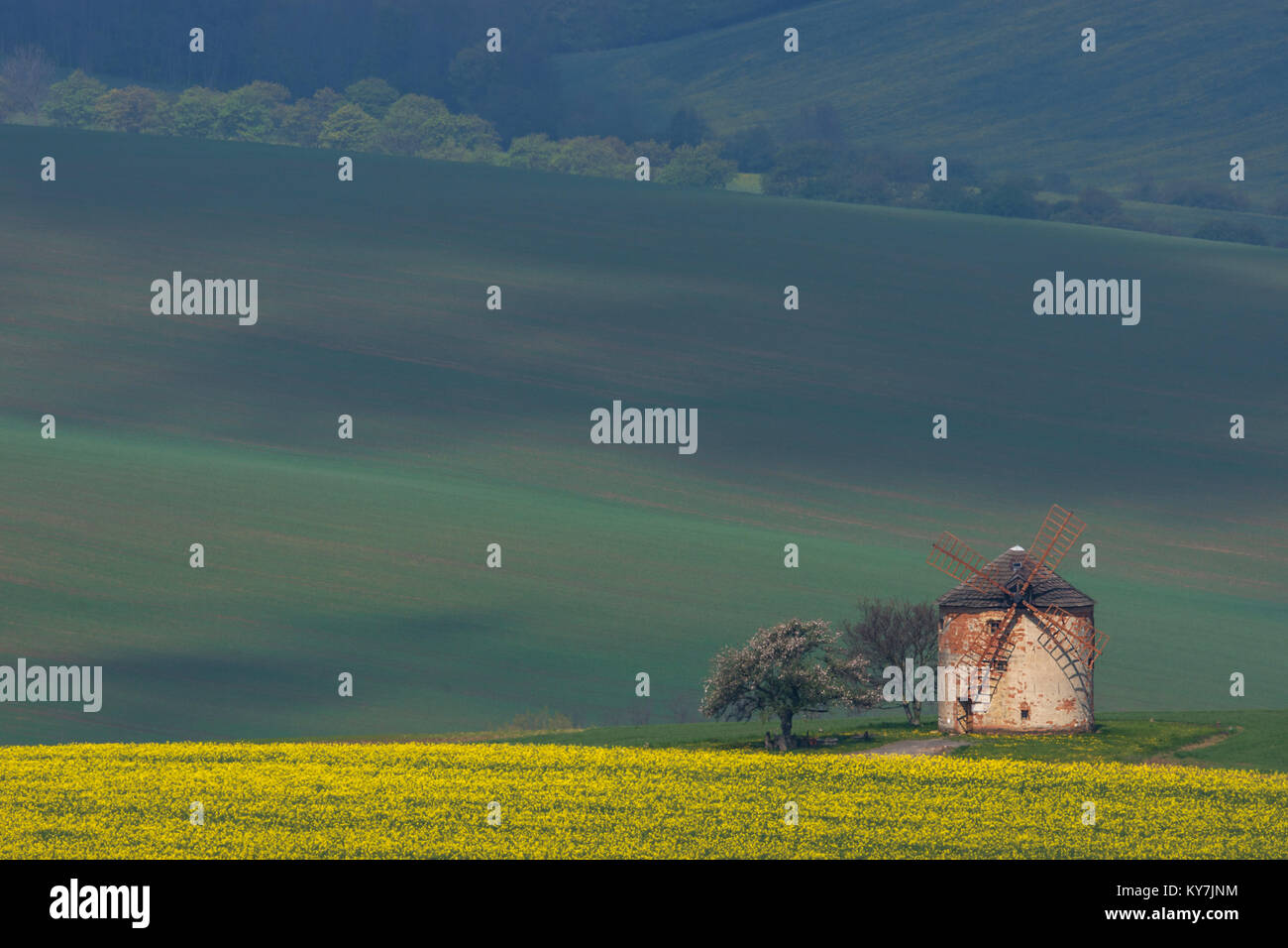 Rural abstract landscape with rolling hills and windmill in South ...