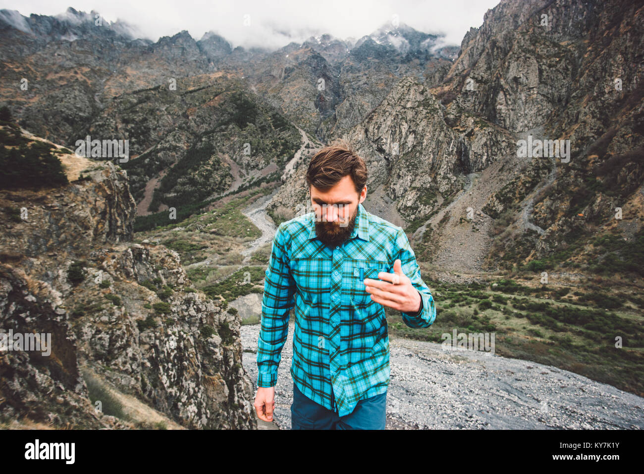 Bearded Man walking in mountains Travel Adventure lifestyle concept ...