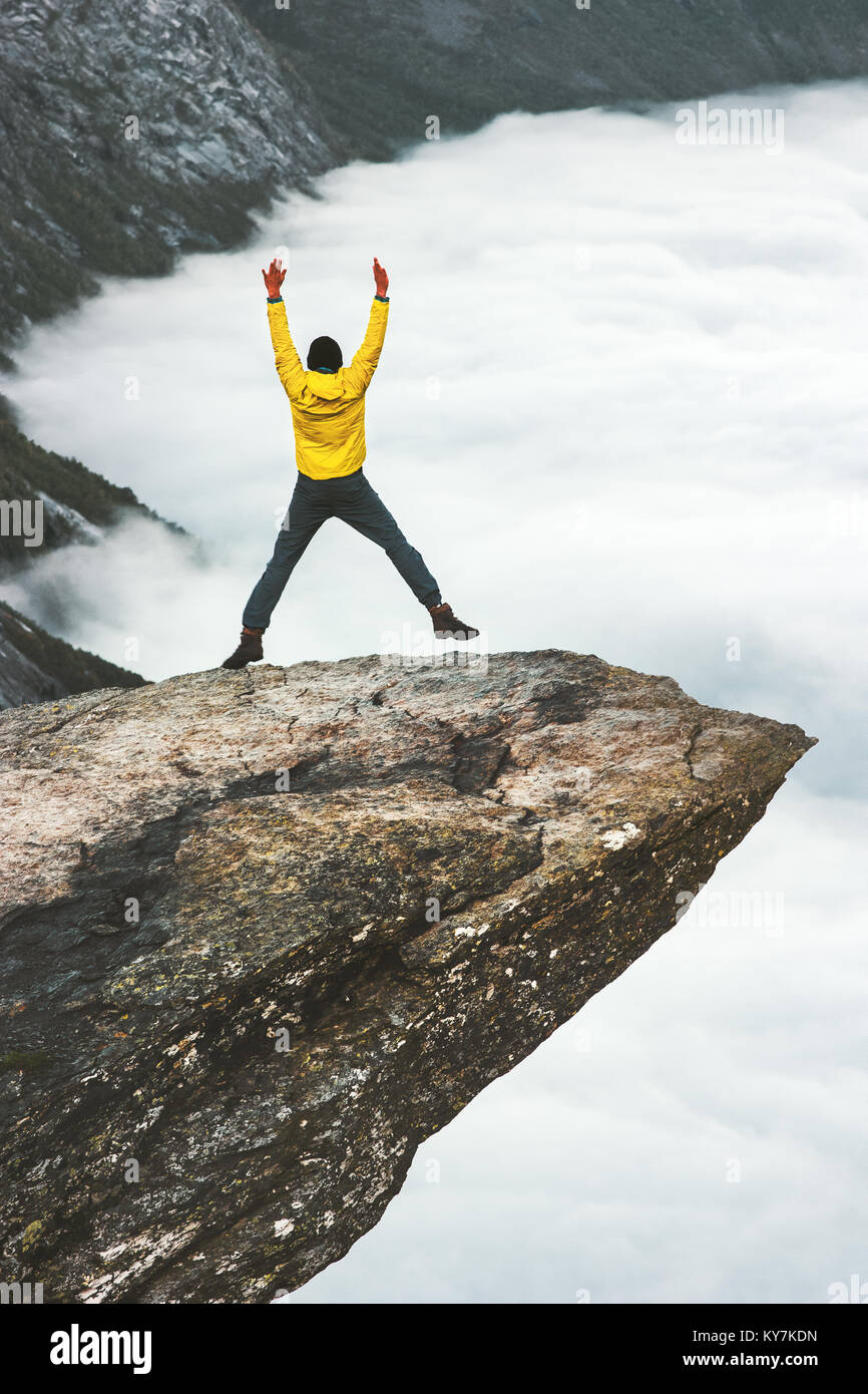 Man Jumping On Edge Cliff High Resolution Stock Photography and Images ...