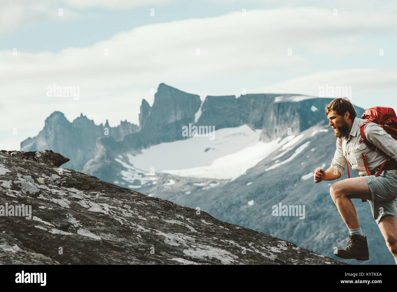 Active Man running in mountains with backpack Norway Travel hiking ...