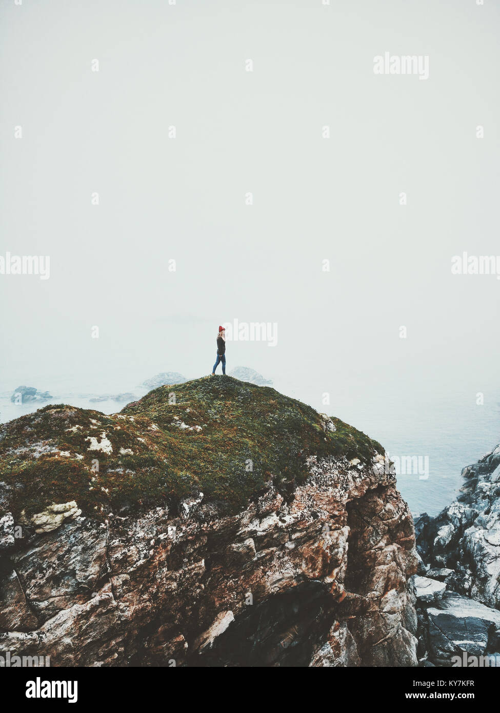 Traveler alone on seaside rocky cliff Norway islands Travel Lifestyle ...