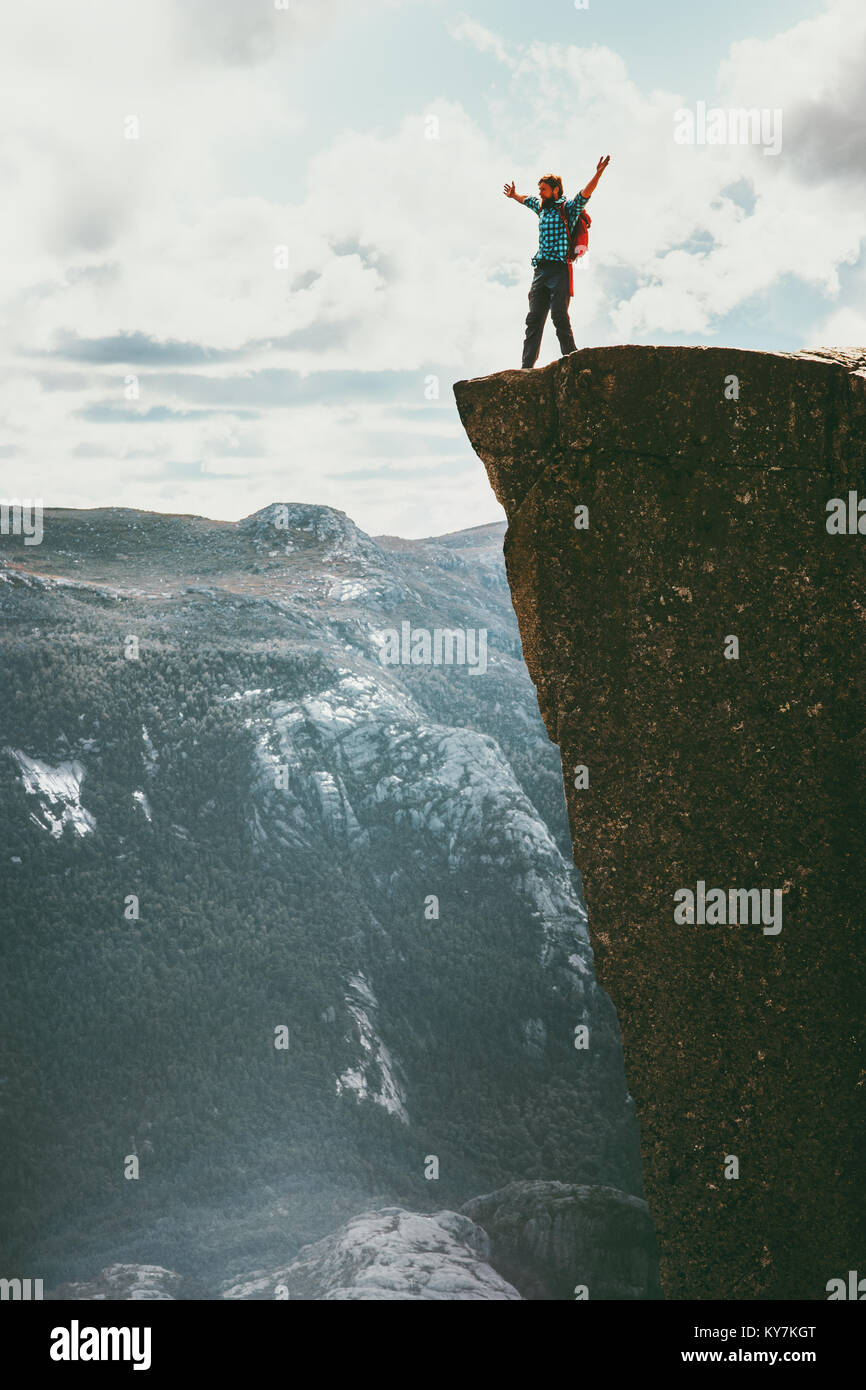Man tourist success raised hands on Preikestolen cliff edge in Norway ...
