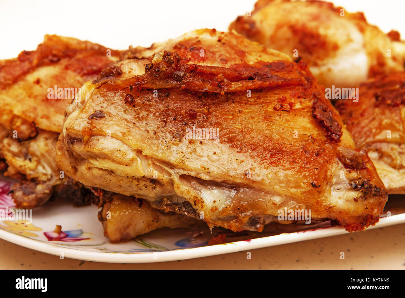 close-up of fatty fried chicken piece on plate Stock Photo - Alamy