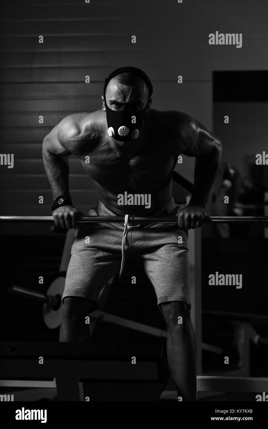 Bodybuilder Doing Push Ups On Barbell As Part Of Bodybuilding Training ...