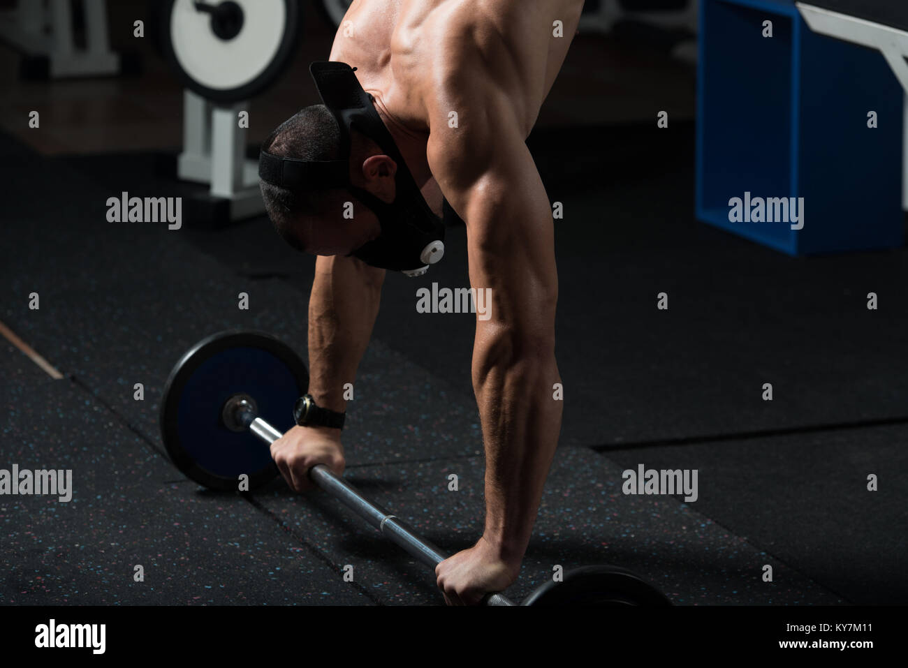 Bodybuilder Doing Push Ups On Barbell As Part Of Bodybuilding Training ...