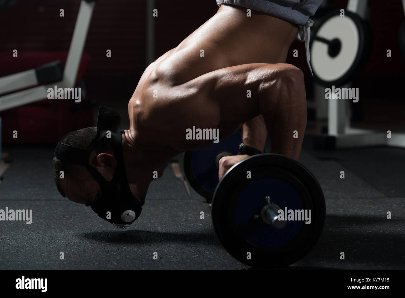 Bodybuilder Doing Push Ups On Barbell As Part Of Bodybuilding Training ...