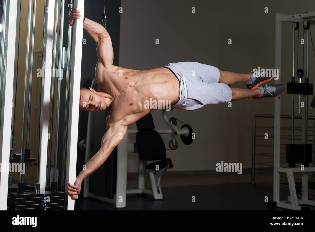 Muscular Man Doing Human Flag Exercise As Part Of Bodybuilding Training ...