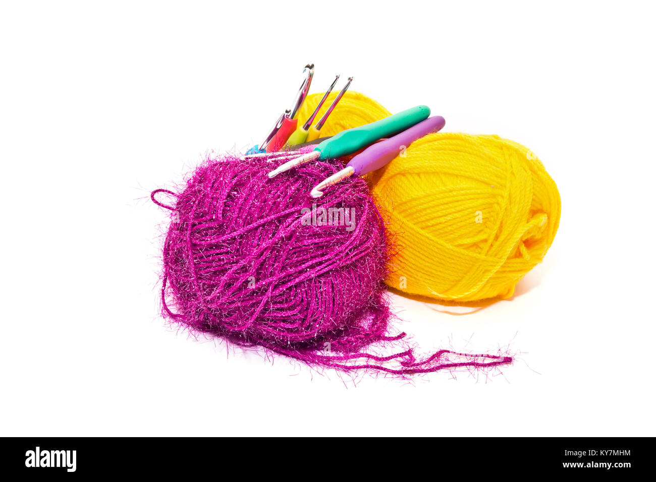Multicolored wool yarn and a set of hooks for knitting isolated on ...
