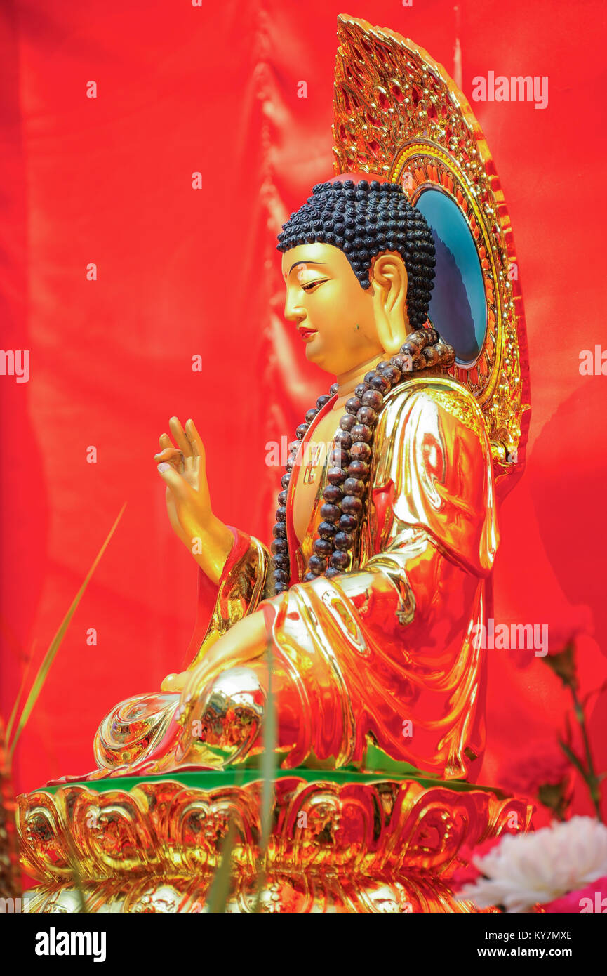 Chinese style Buddha Image with red background Stock Photo - Alamy