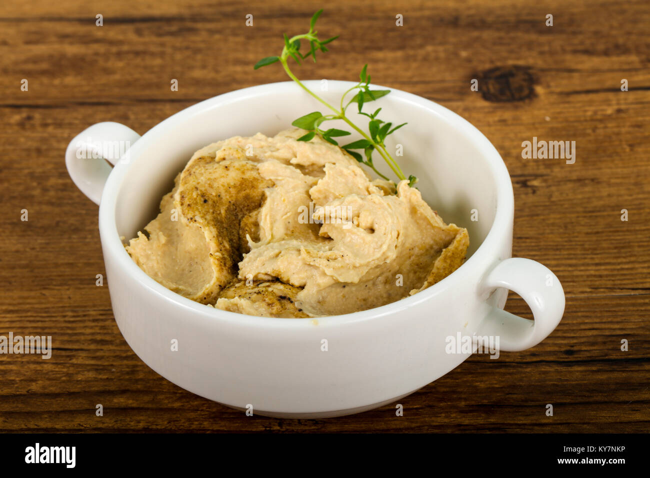 Vegetarian Humus with sesame seeds and thyme leaves Stock Photo - Alamy