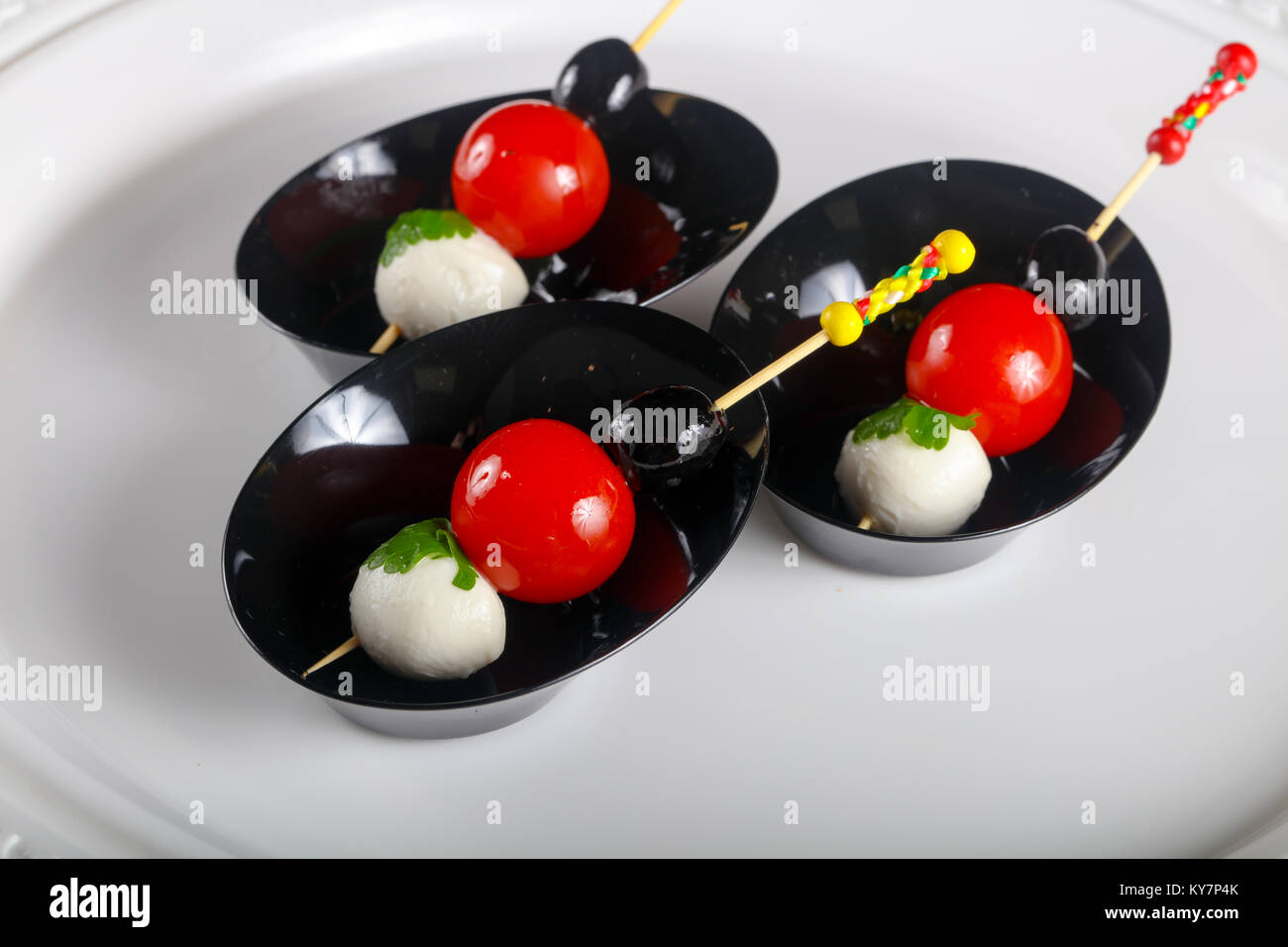 Canape with tomato and mozarella cheese Stock Photo - Alamy