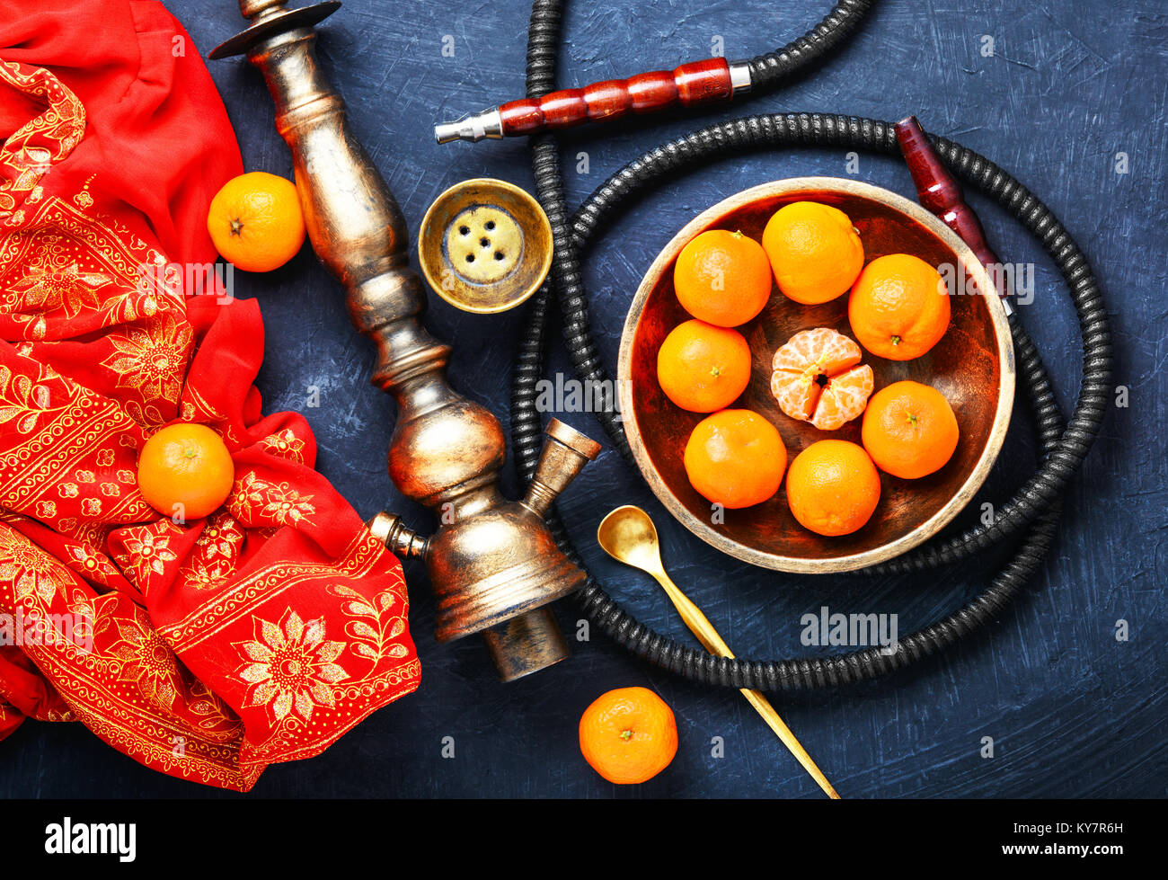 Smoking smoking shisha in east style with tobacco aroma of mandarin ...