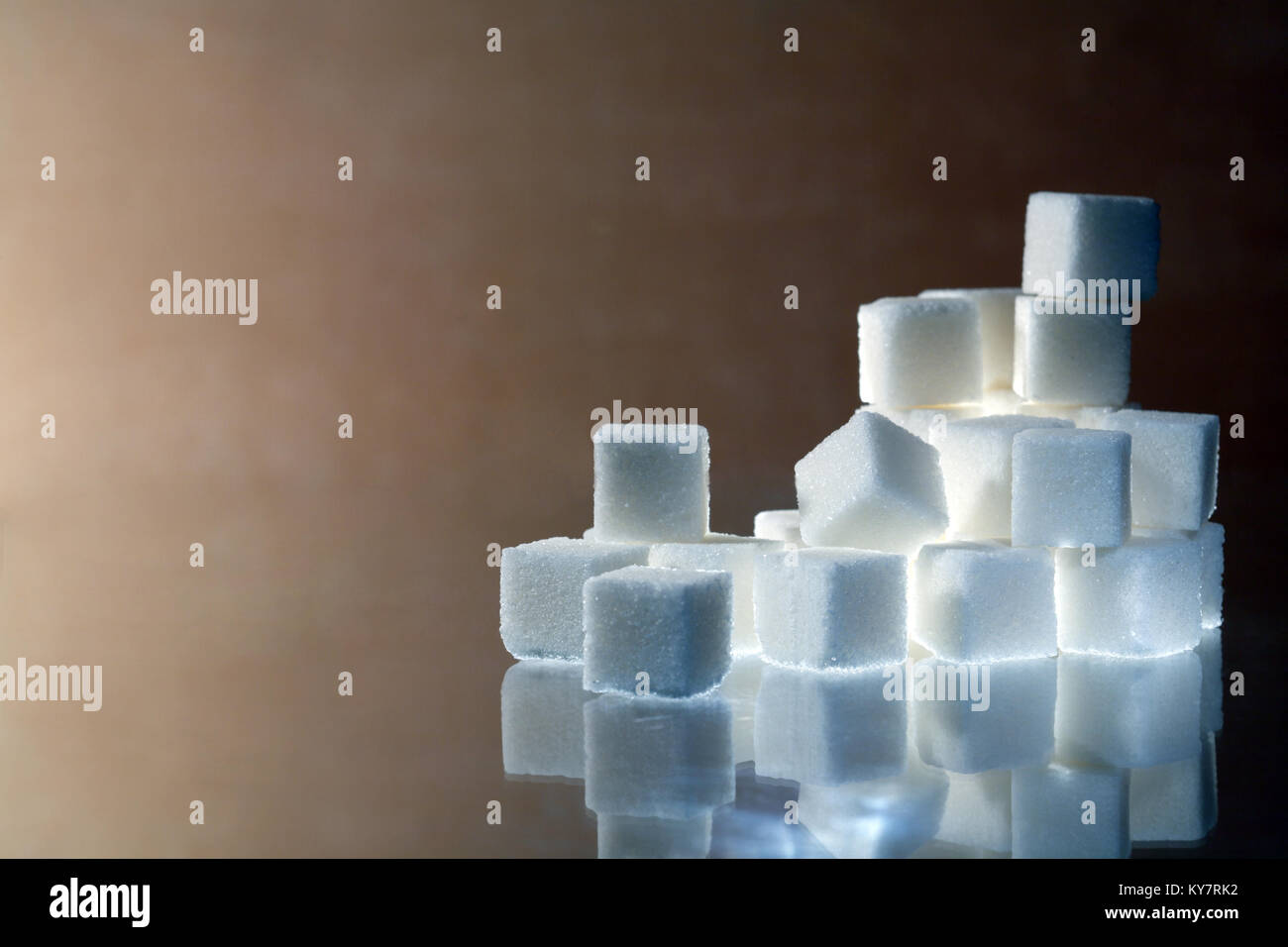 Stack of sugar cubes with reverberation on nice gray background with ...