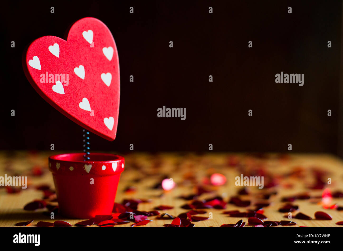 Heart on wooden table with black background Stock Photo - Alamy