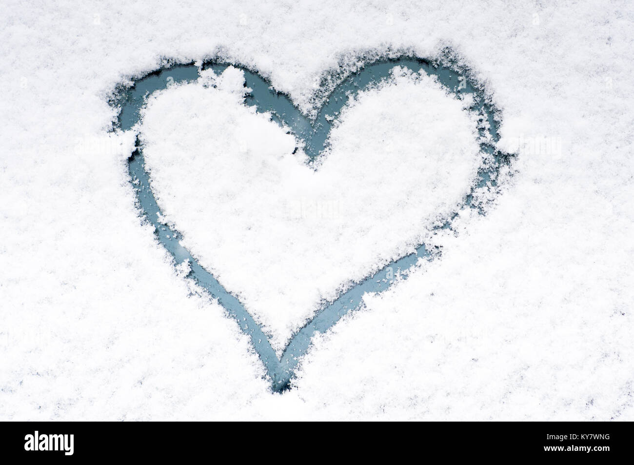 Heart in snow Stock Photo - Alamy