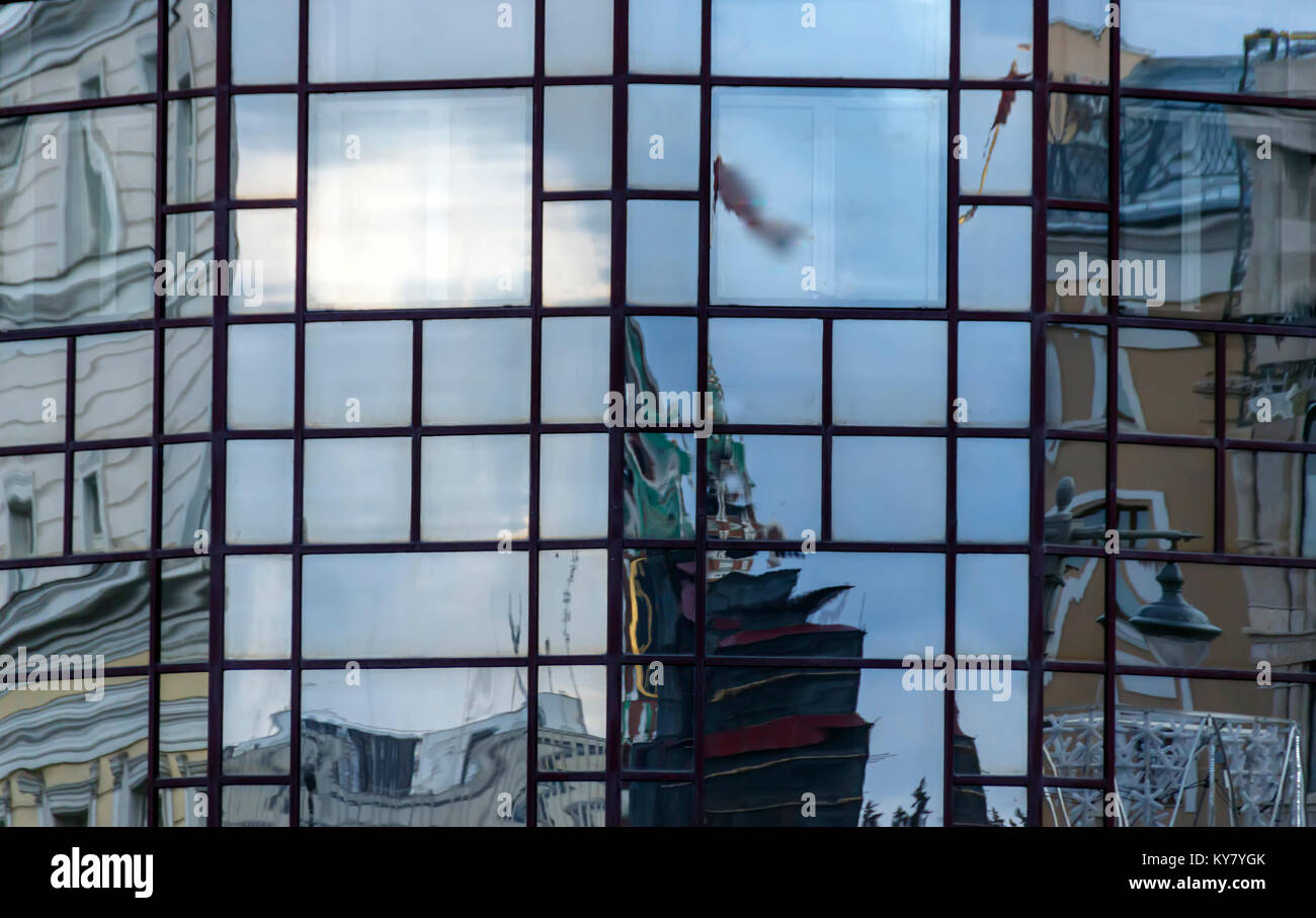 Reflection of city buildings in glass windows Stock Photo - Alamy