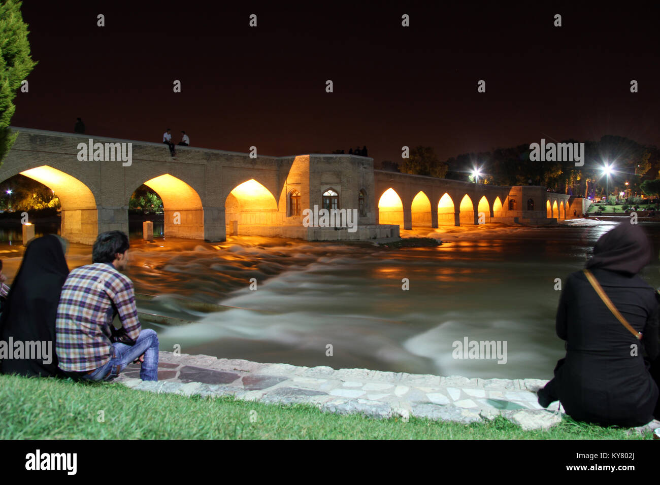 People near river with bridge in Esfahan, Iran Stock Photo - Alamy