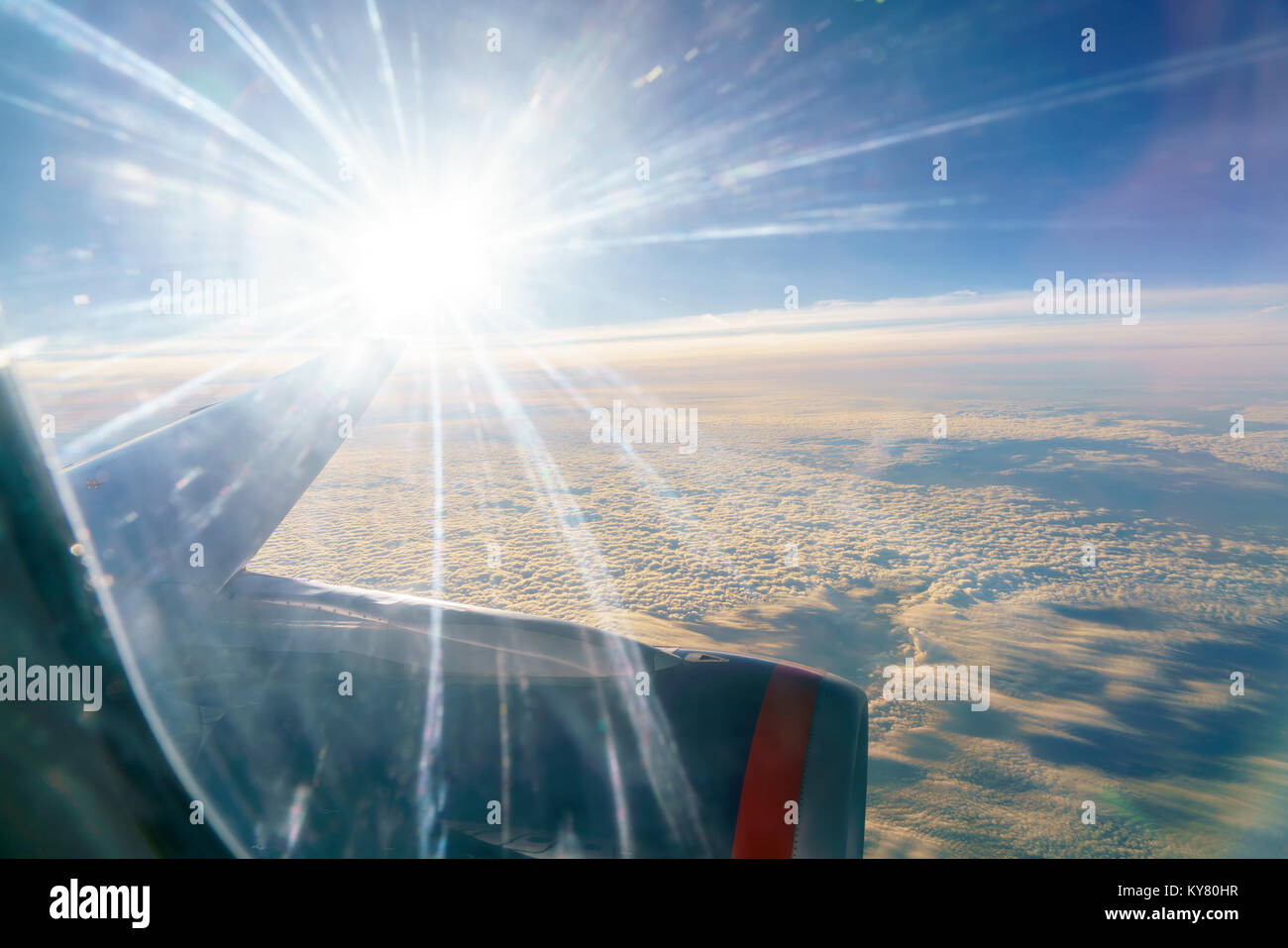 The bright sun shining in the window of an airplane at sunrise Stock ...