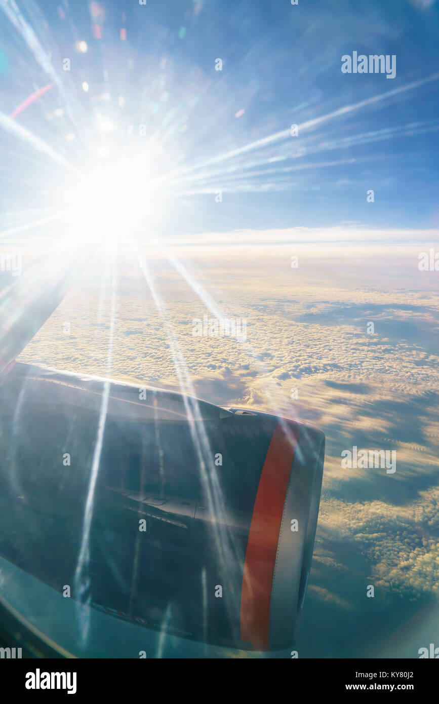 The bright sun shining in the window of an airplane at sunrise Stock ...