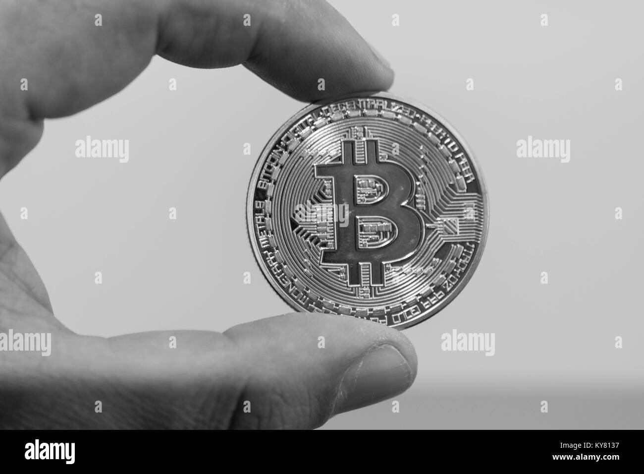 Hand holding golden Bitcoin virtual money Stock Photo - Alamy