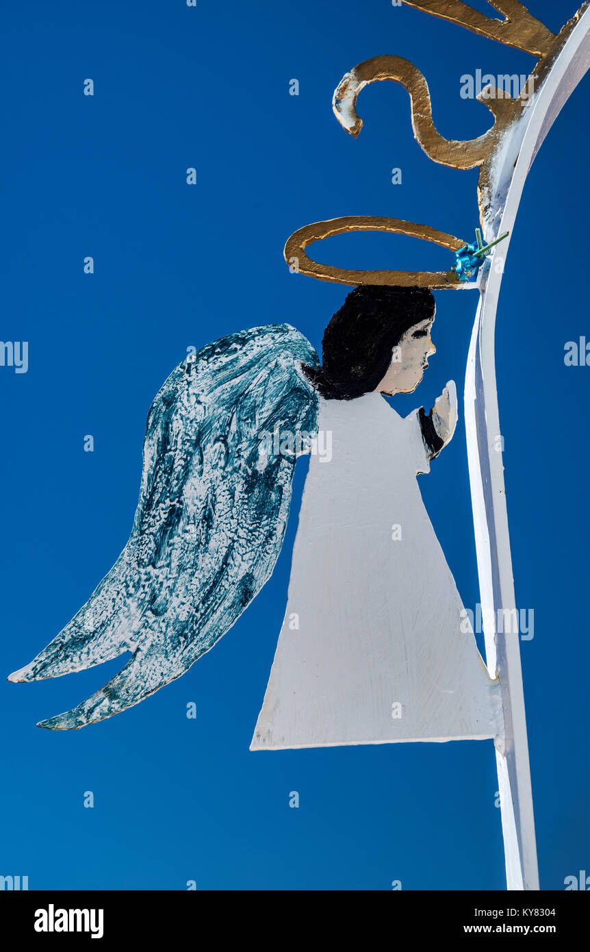 Wrought iron angel on gate at Our Lady of Sorrows Church in Manzano ...