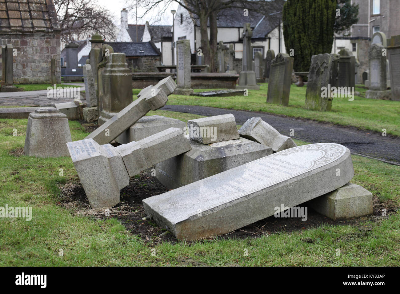 Damaged gravestones lie in the graveyard of Corstorphine Old Parish ...