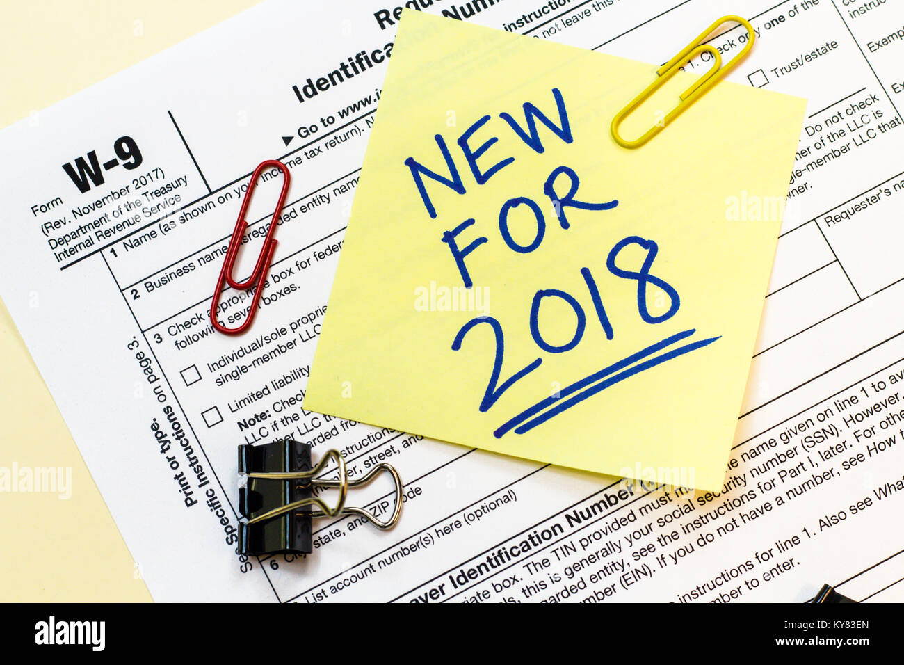 A W9 tax form with New for 2018 written on a sticky note Stock Photo ...