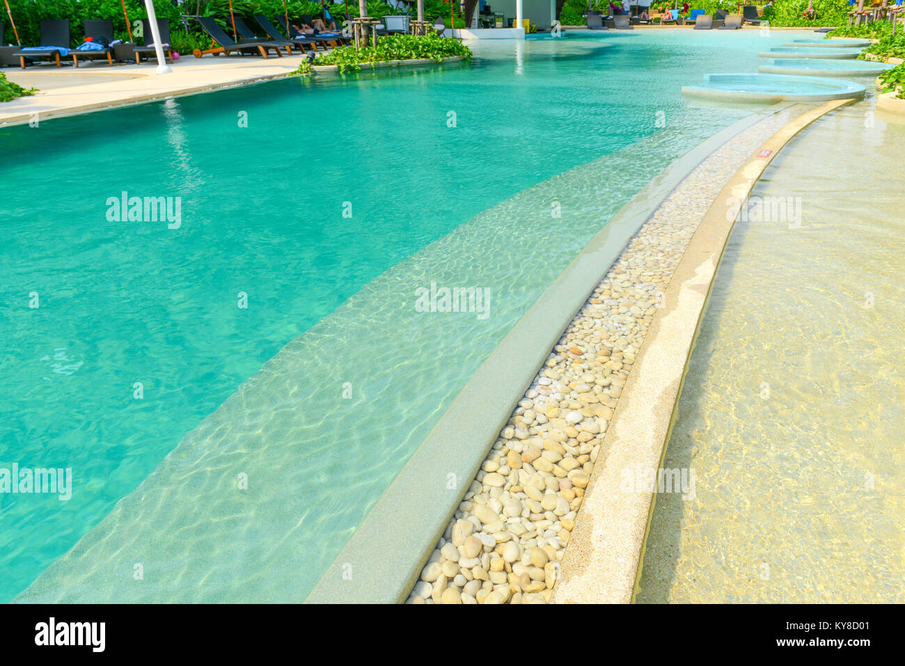 Beautiful luxury swimming pool in hotel resort. Decoration and design ...