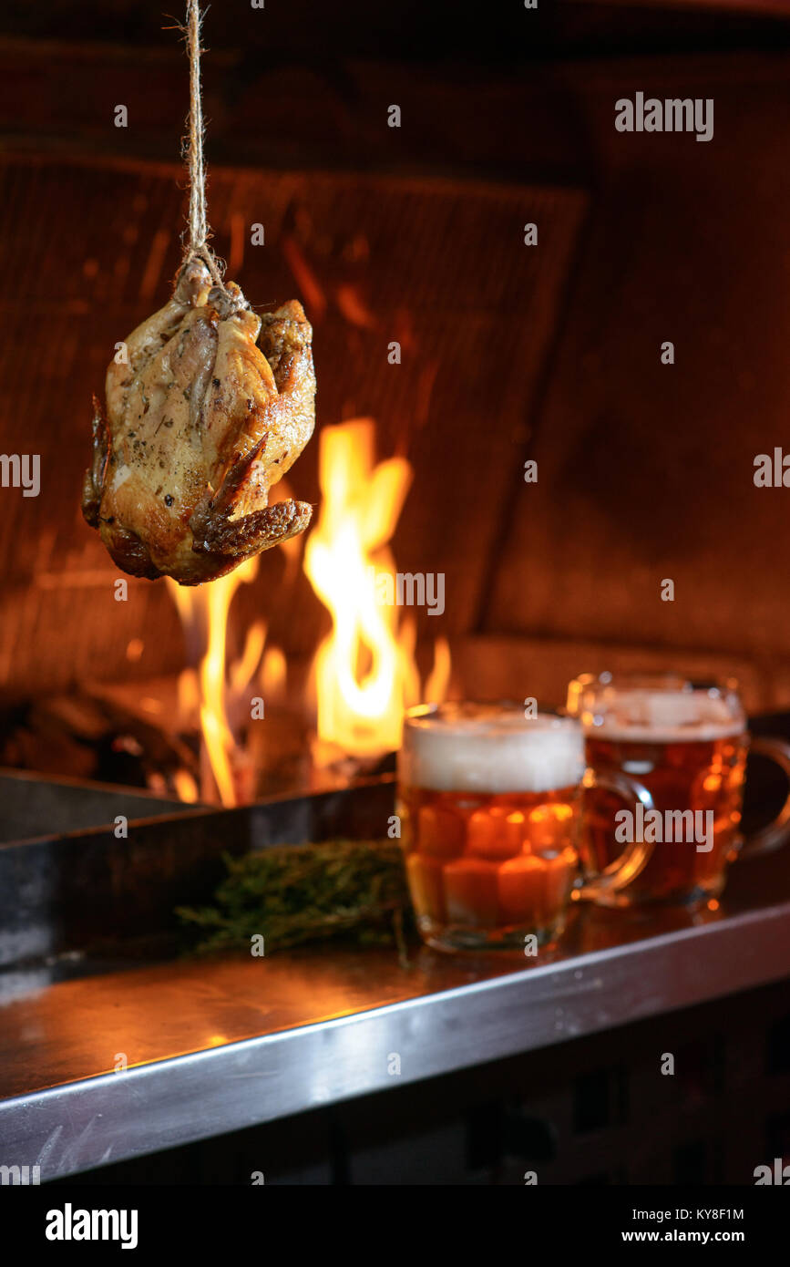 Hanged Chicken Grill Stock Photo - Alamy