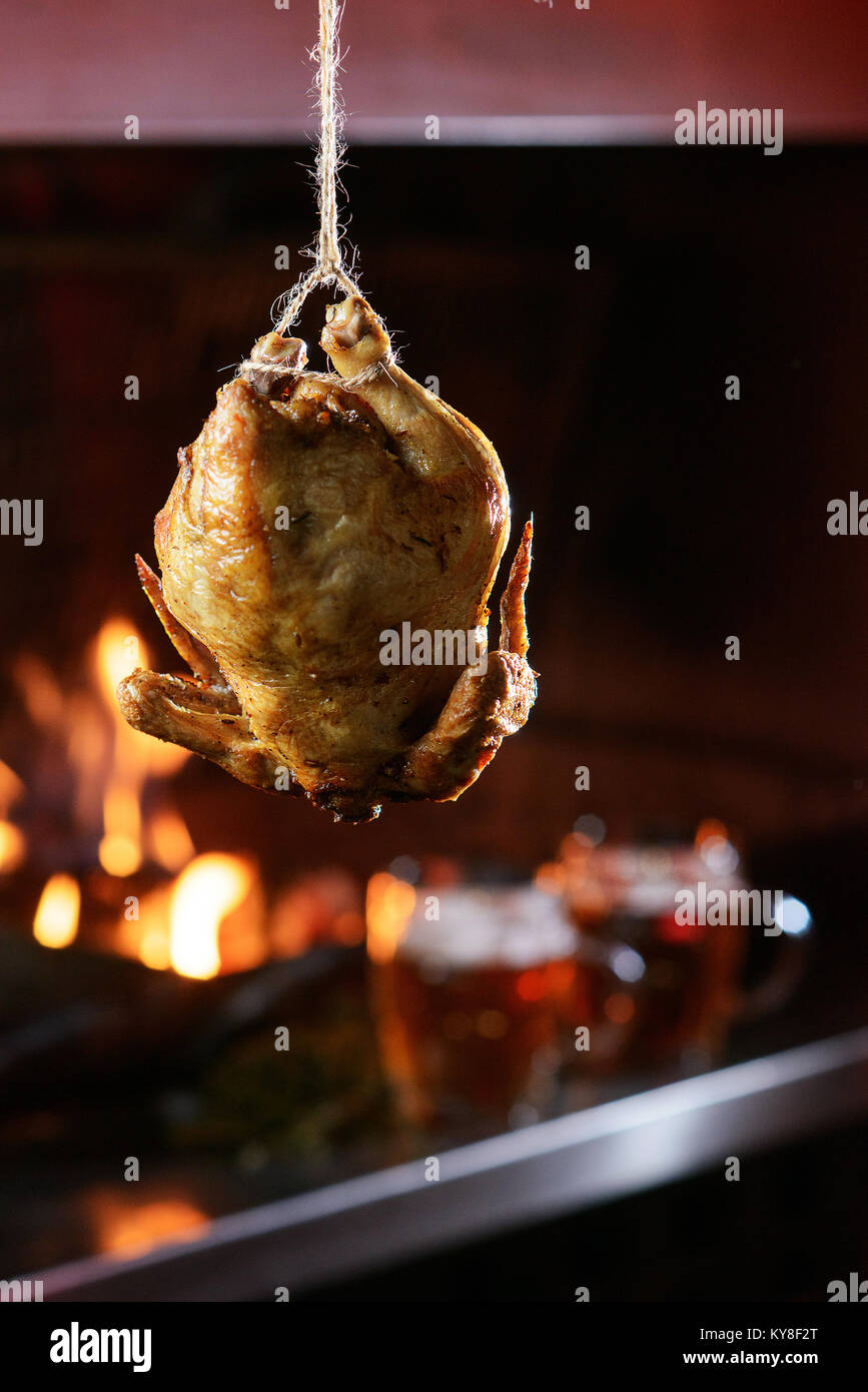 Hanged Chicken Grill Stock Photo - Alamy
