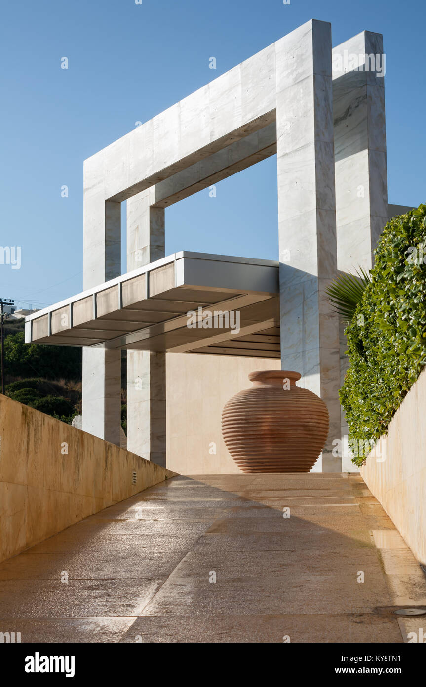 Imposing main entrance to Cretan hotel with marble lintels and giant ...