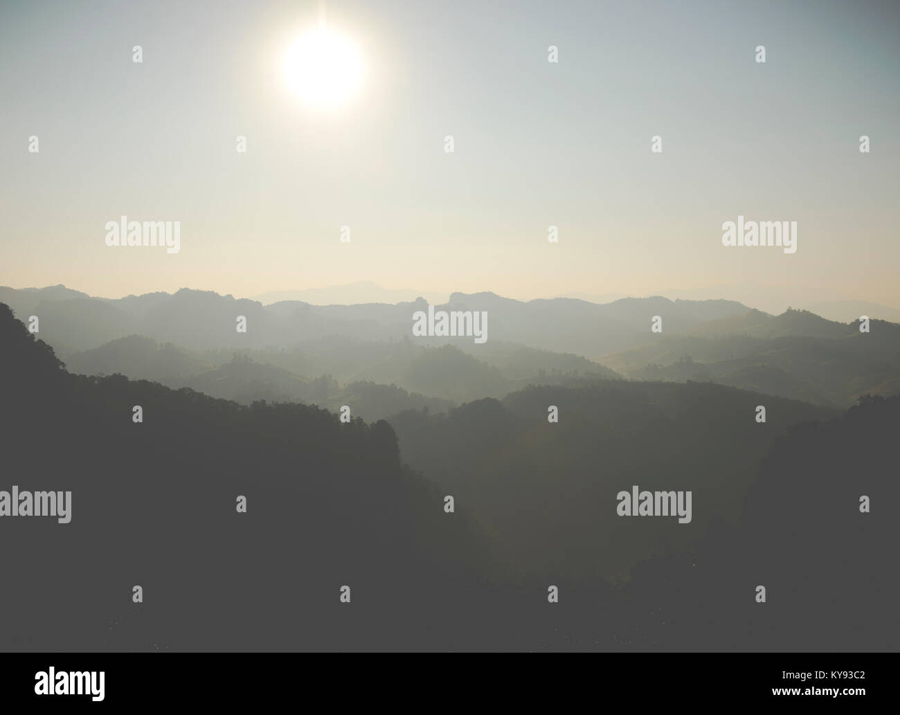 The rising of the sun over a mountain range Stock Photo - Alamy